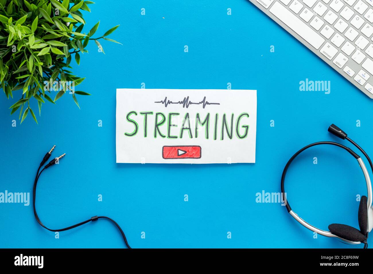 Online streaming social media concept. Paper tablet on office desk top ...