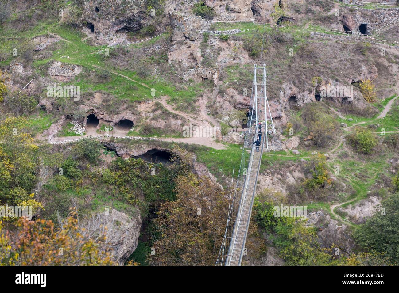 The cave village of Khndzoresk is connected by a suspension bridge that ...