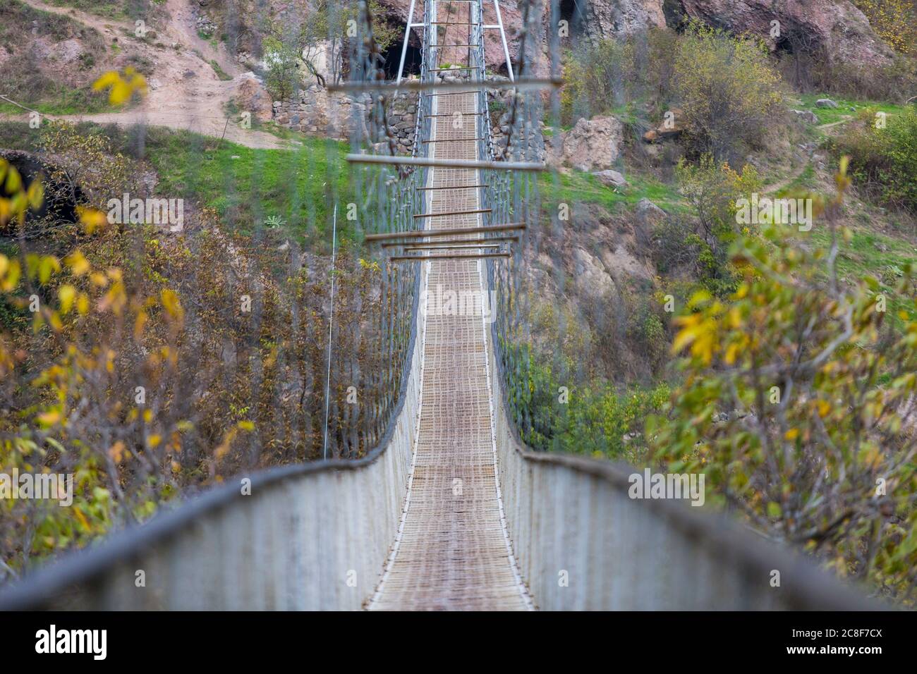 The cave village of Khndzoresk is connected by a suspension bridge that ...