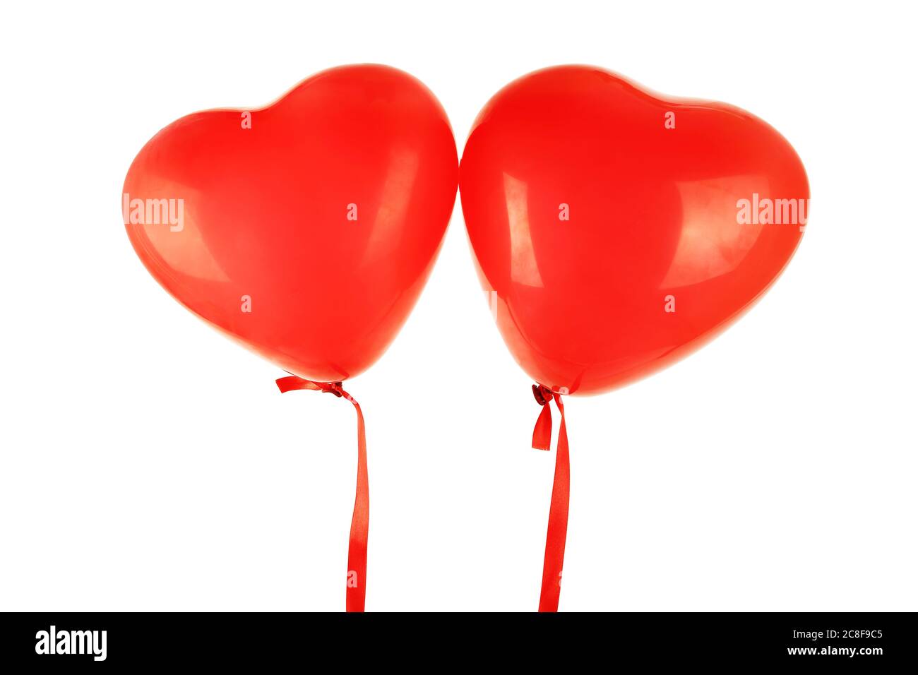 two red heart-shaped balloons isolated on white Stock Photo - Alamy