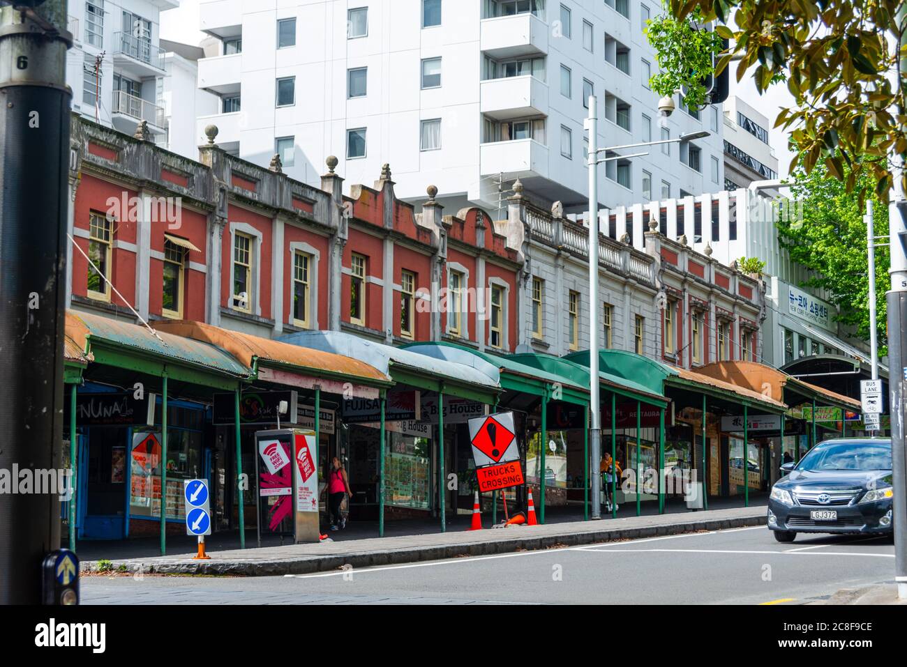 row of red brick shops on Queen Street, Auckland Stock Photo - Alamy