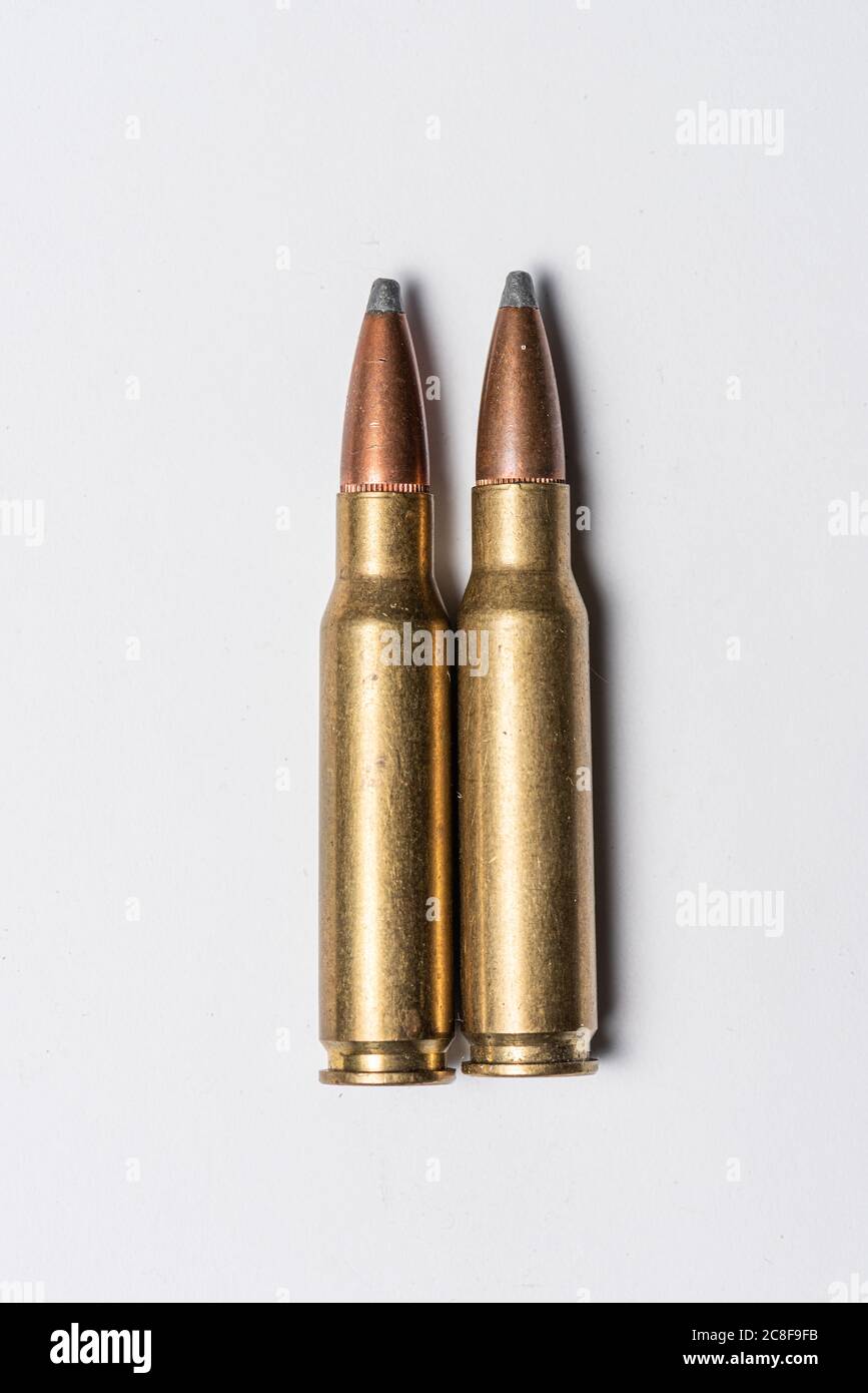 Old rifle bullets on white background Stock Photo - Alamy