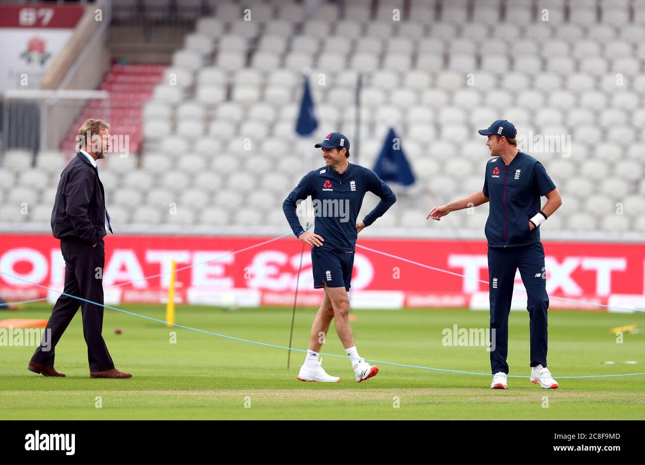 England's James Anderson and Stuart Broad (right) with his father and match referee Chris Broad ...