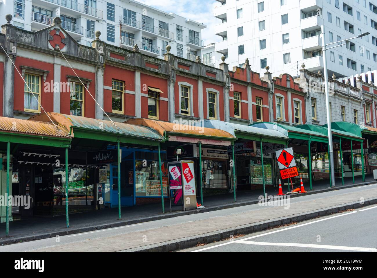row of red brick shops on Queen Street, Auckland Stock Photo - Alamy