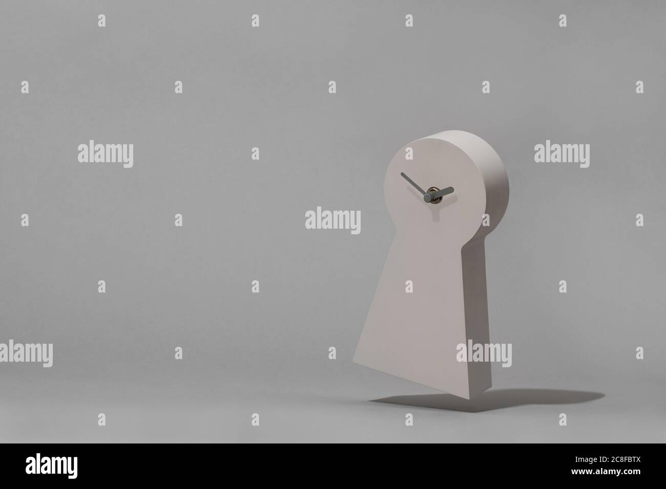 Key hole shaped clock floating just above the surface with plenty of ...