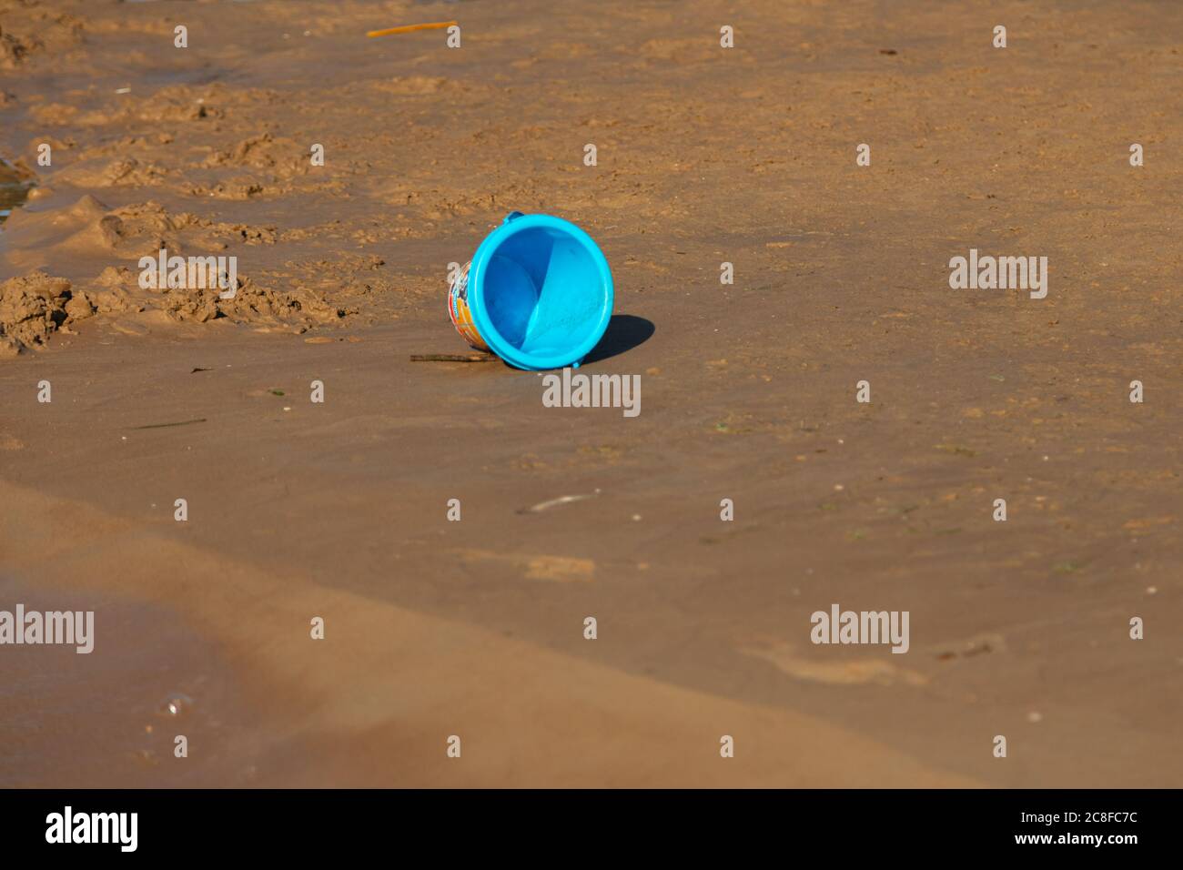 Blue, baby bucket on the beach. Sandy shore. High quality photo Stock ...