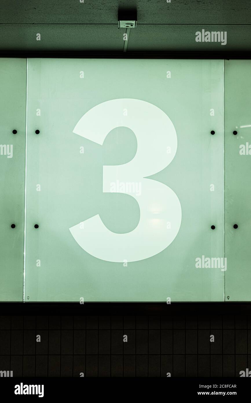 The number three, 3, on a glass wall Stock Photo - Alamy