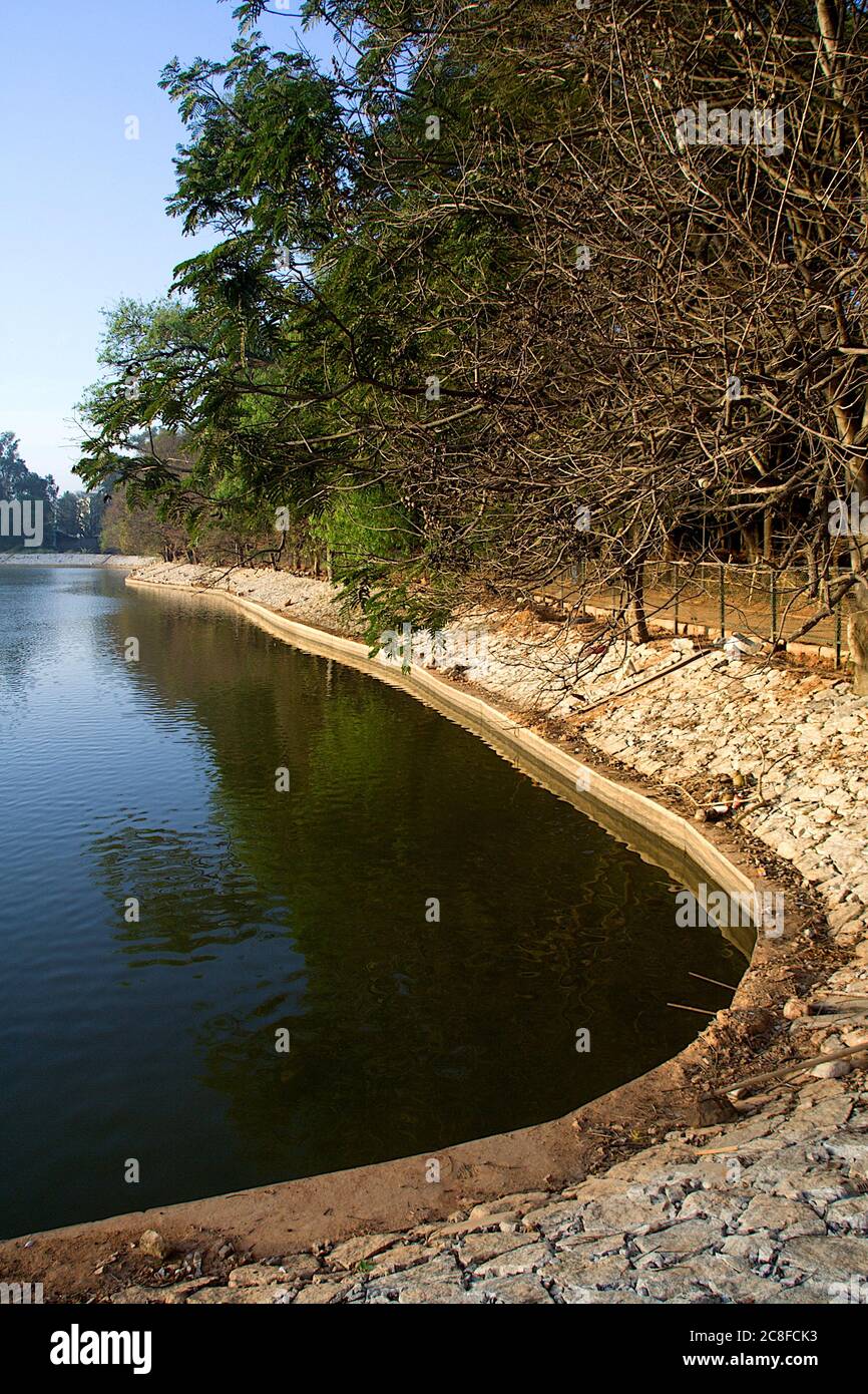 View of rubbled stone sloping edge at Lalbagh Lake in Bengaluru ...