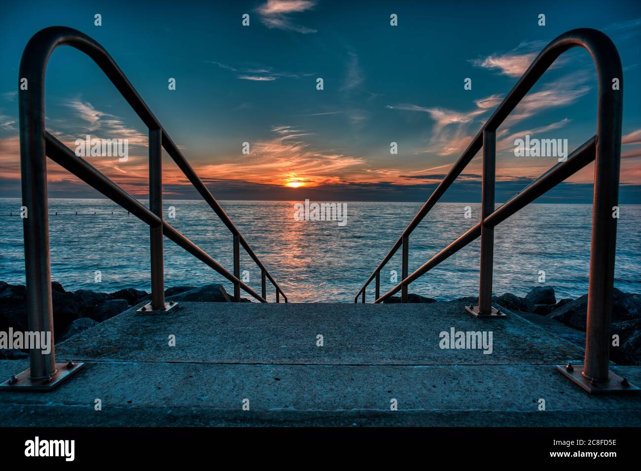 Steps to the sunset sea Stock Photo - Alamy
