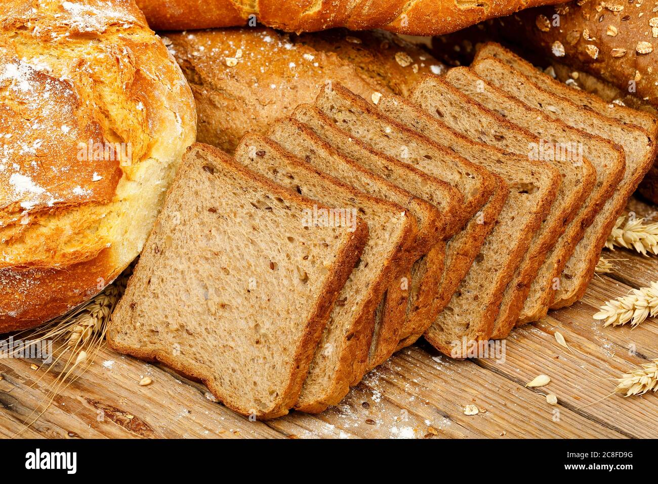 wholesome sliced toast bread with traditional types of bread, full ...