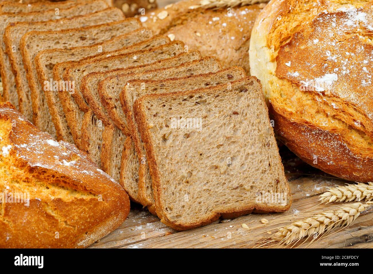 wholesome sliced toast bread with traditional types of bread, full ...