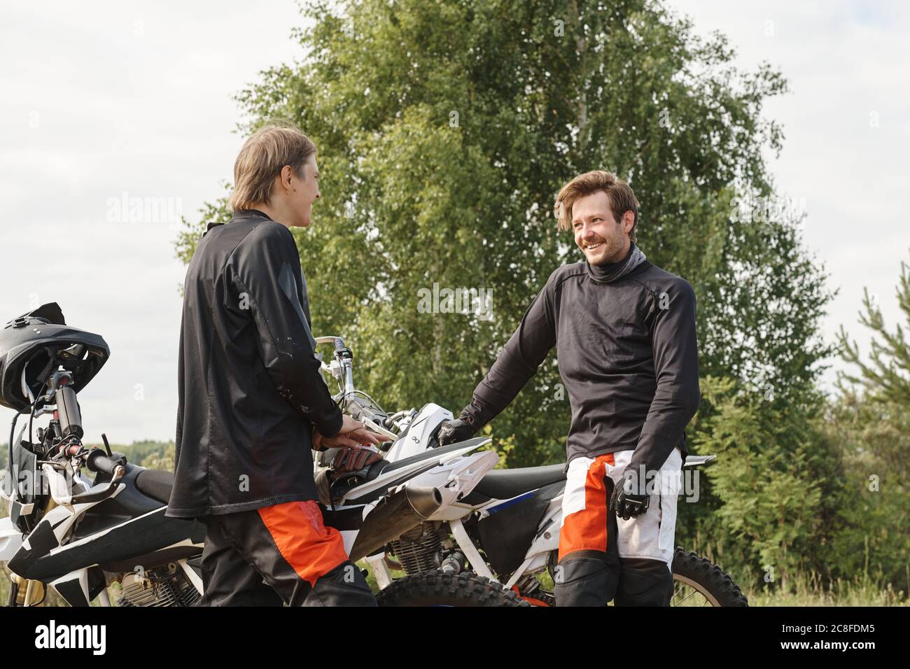 Talking to motorcyclist hi-res stock photography and images - Alamy