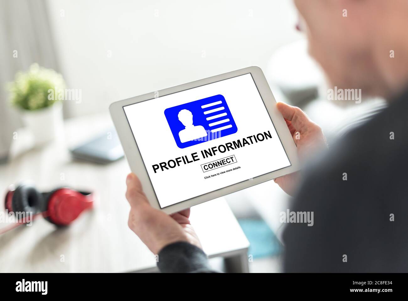 Tablet screen displaying a profile information concept Stock Photo - Alamy