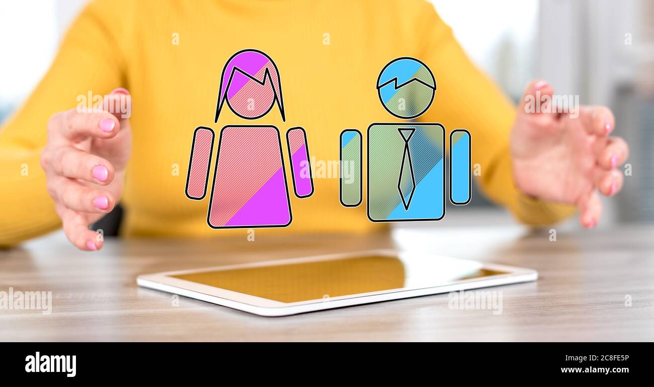 Digital tablet with gender equality concept between hands of a woman in ...