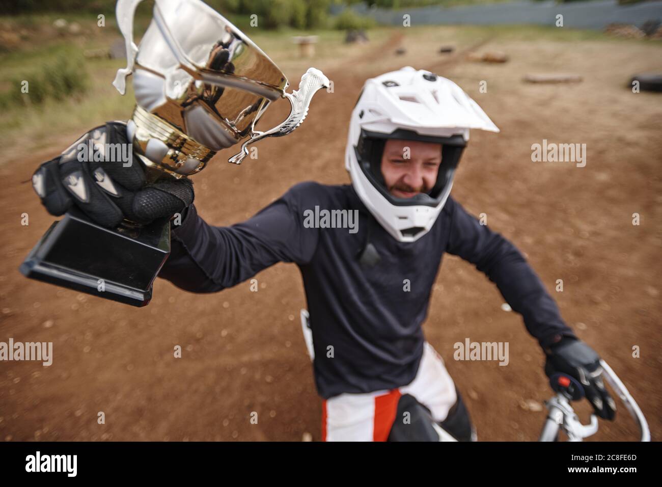 Hand raising cup hi-res stock photography and images - Alamy