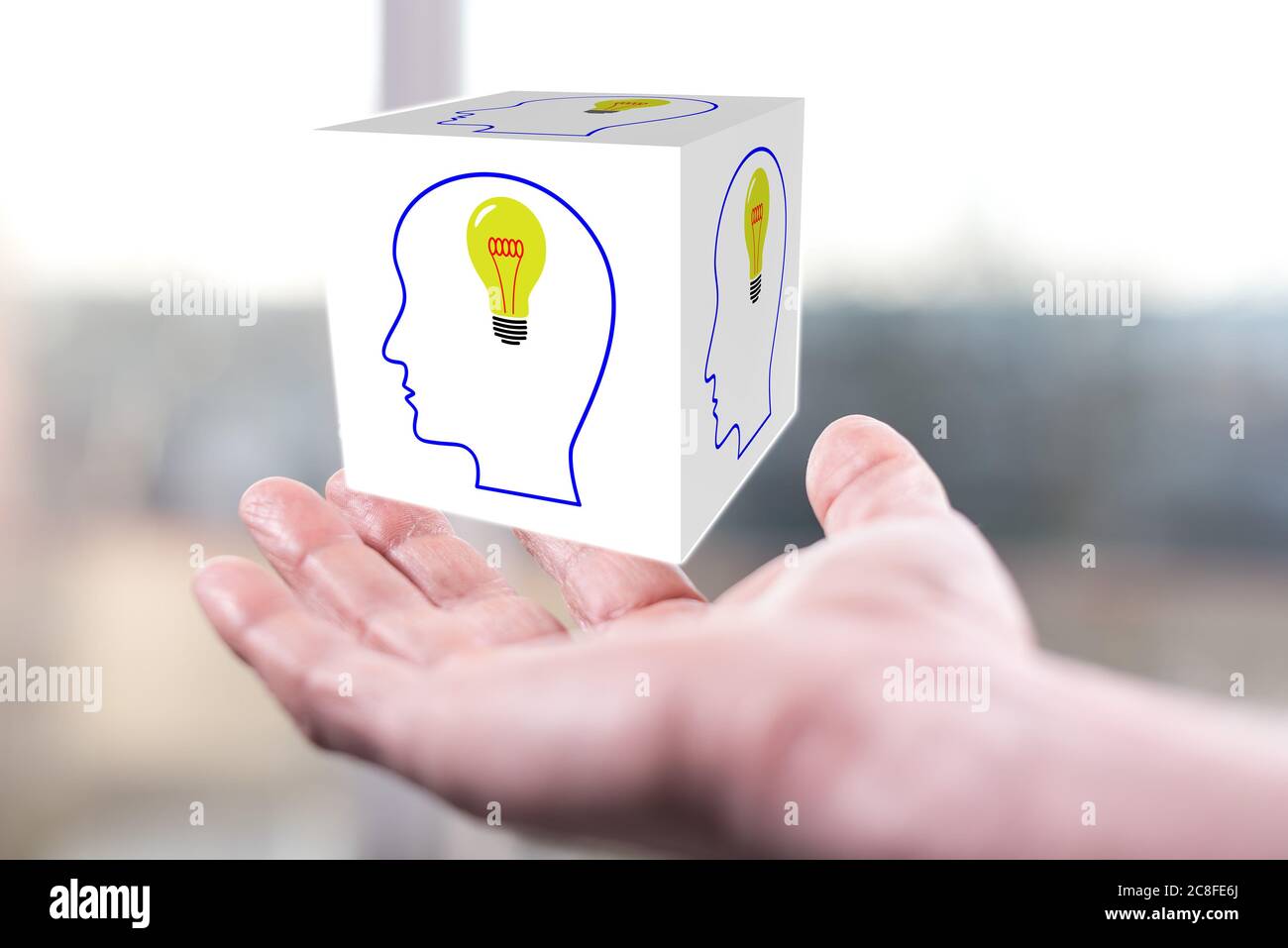 Human brain ideas concept above a hand of a man Stock Photo - Alamy
