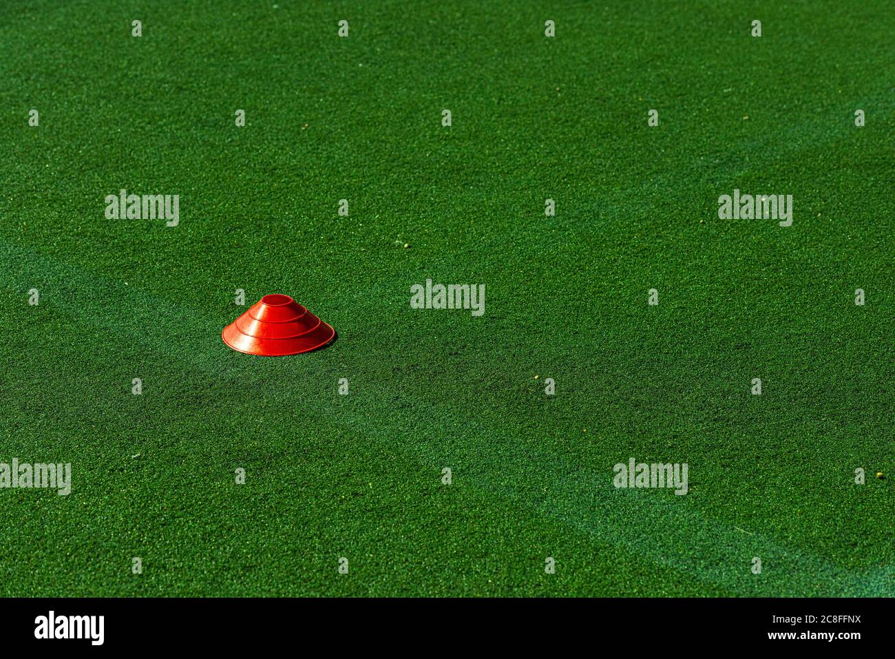 Red plastic cone on a fooball field Stock Photo - Alamy