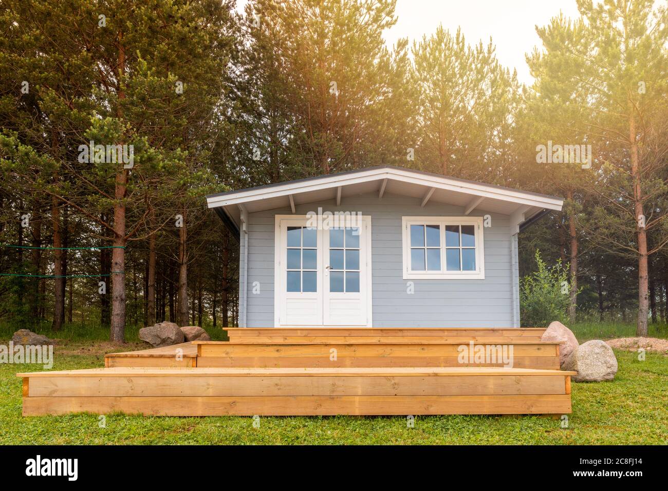 Small European-style resort wooden house or wooden hut in a pine forest ...