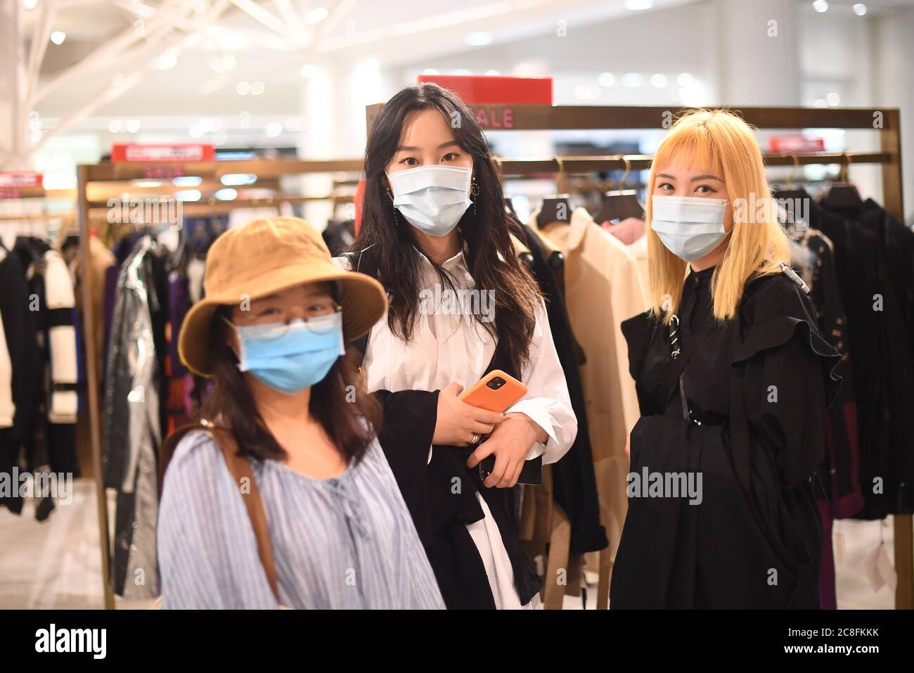 Shoppers wearing face masks in Selfridges on Oxford Street, London, as ...