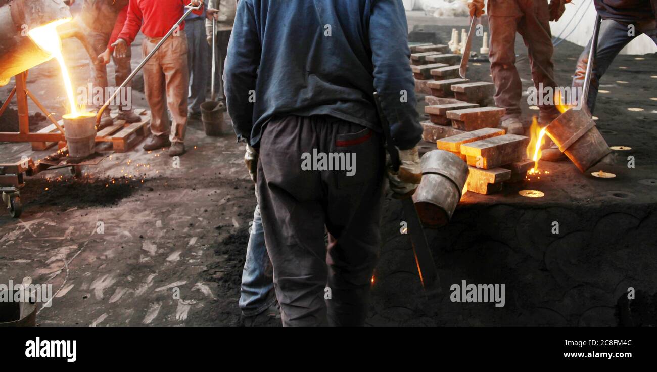 Workers at the casting factory Stock Photo - Alamy