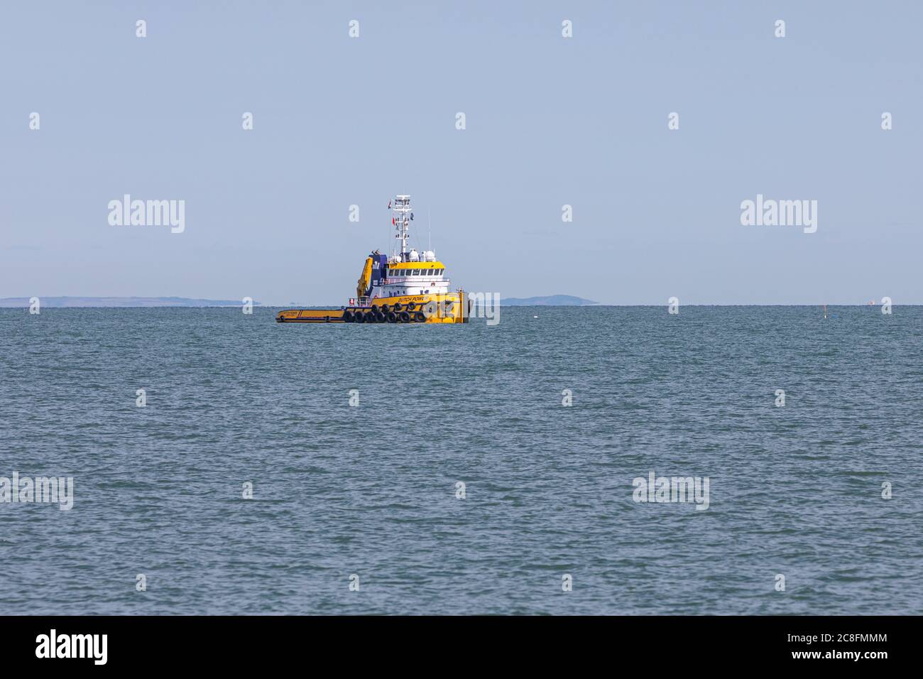 A yellow barge in the English Channel Stock Photo - Alamy