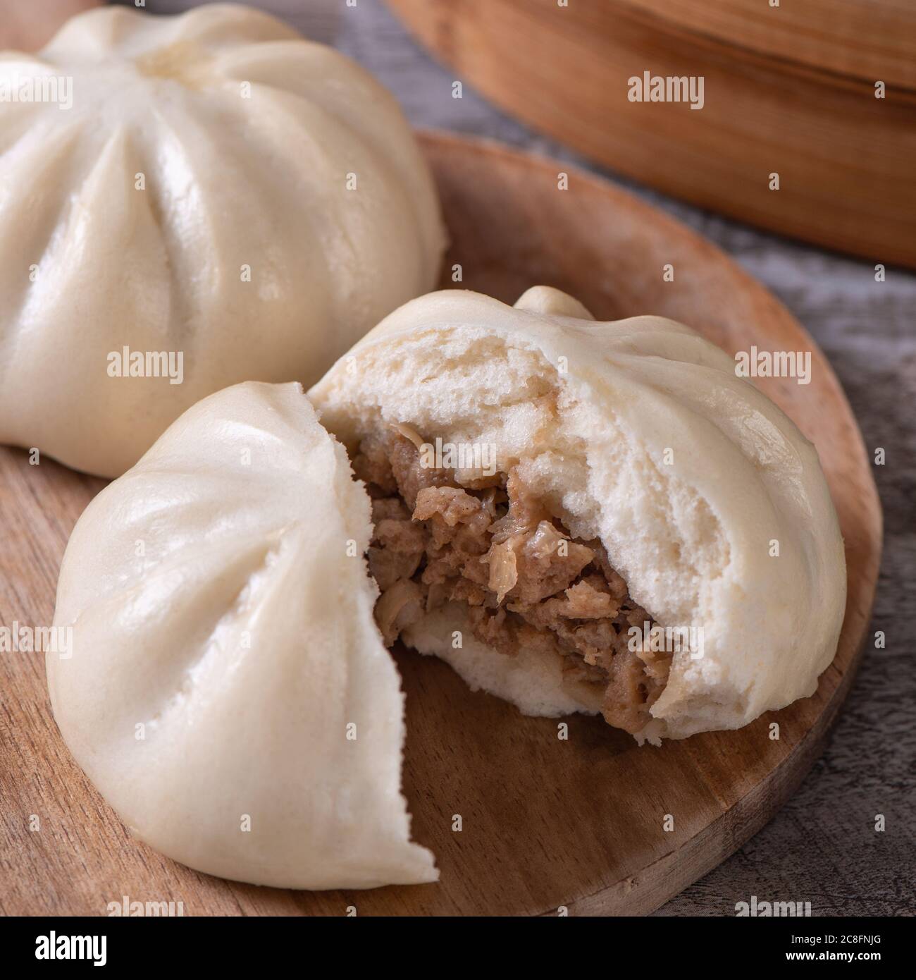 Delicious baozi, Chinese steamed meat bun is ready to eat on serving ...