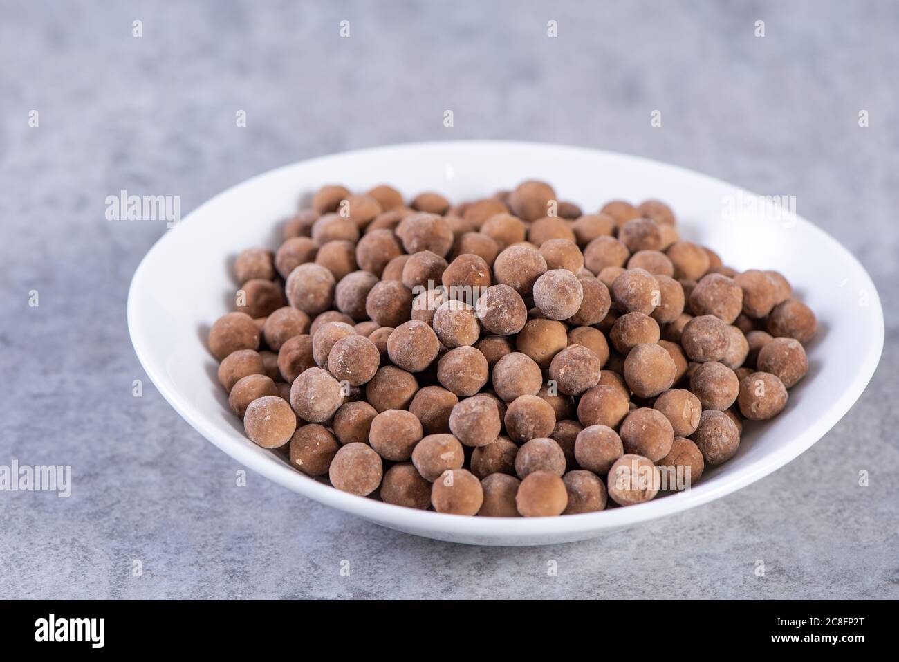 Dry raw brown tapioca pearls isolated on gray cement concrete ...
