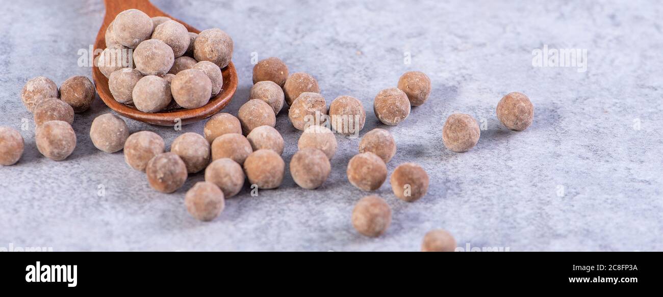 Dry raw brown tapioca pearls isolated on gray cement concrete ...