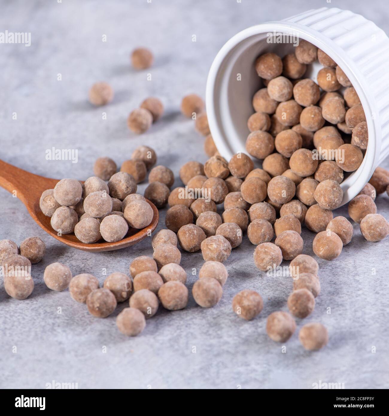 Dry raw brown tapioca pearls isolated on gray cement concrete ...
