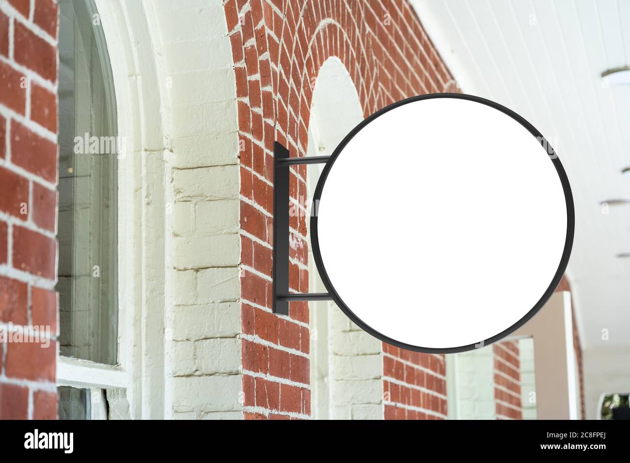 Round white company sign mockup in a city Stock Photo - Alamy