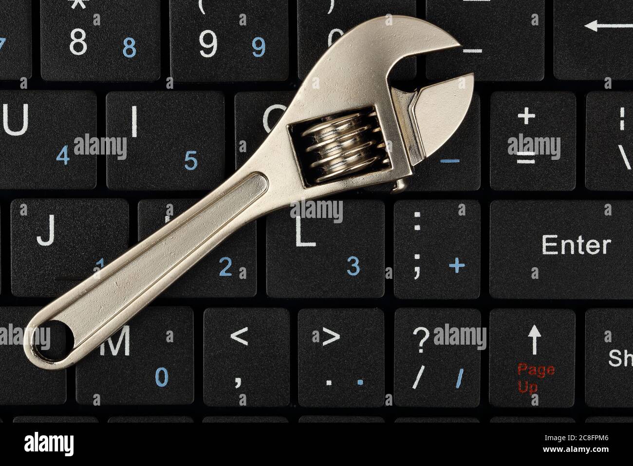 wrench on computer keyboard, computer repair concept Stock Photo - Alamy