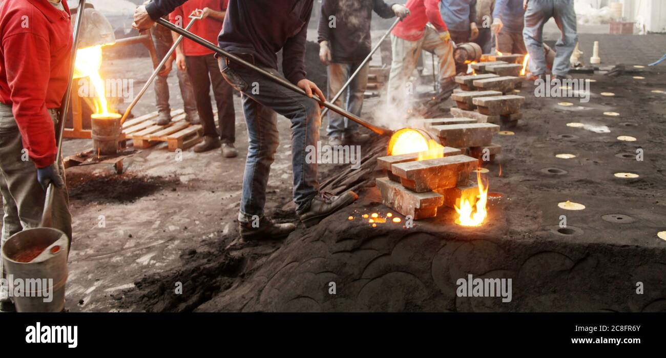 Workers at the casting factory Stock Photo - Alamy