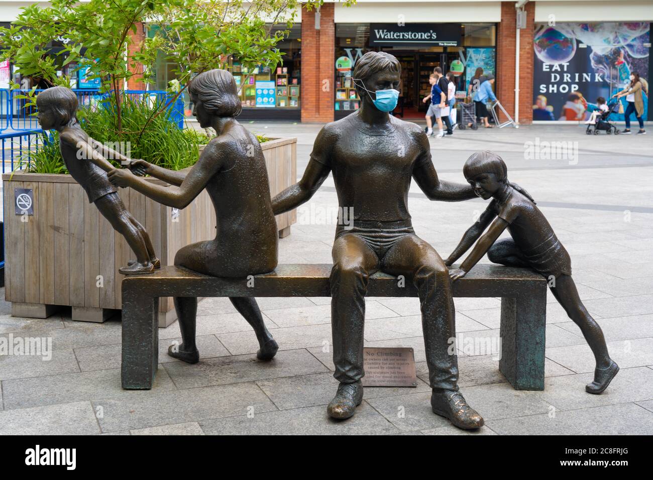 London, UK. Friday, 24 July, 2020 A statue of a family with one of the ...