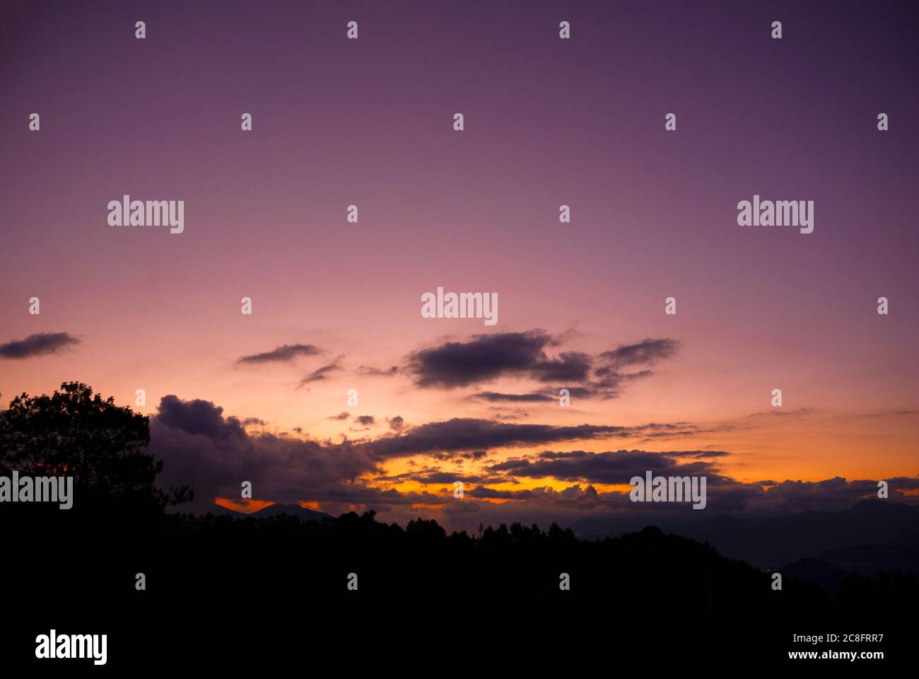 Sunset with clouds and shadows with partially clear sky, shadows cast ...