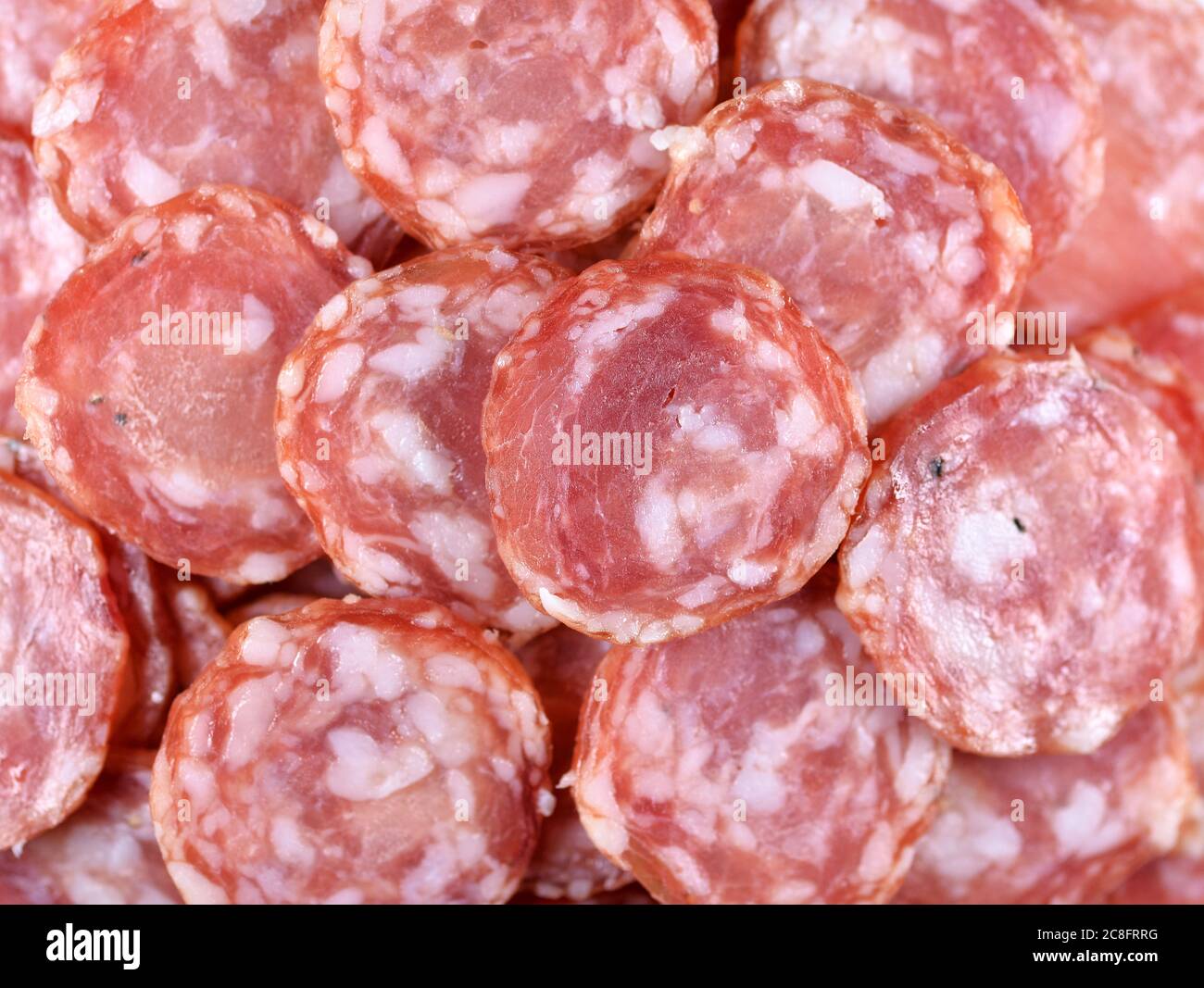 Salami sausage slices background. Close up. Slices of smoked sausage ...