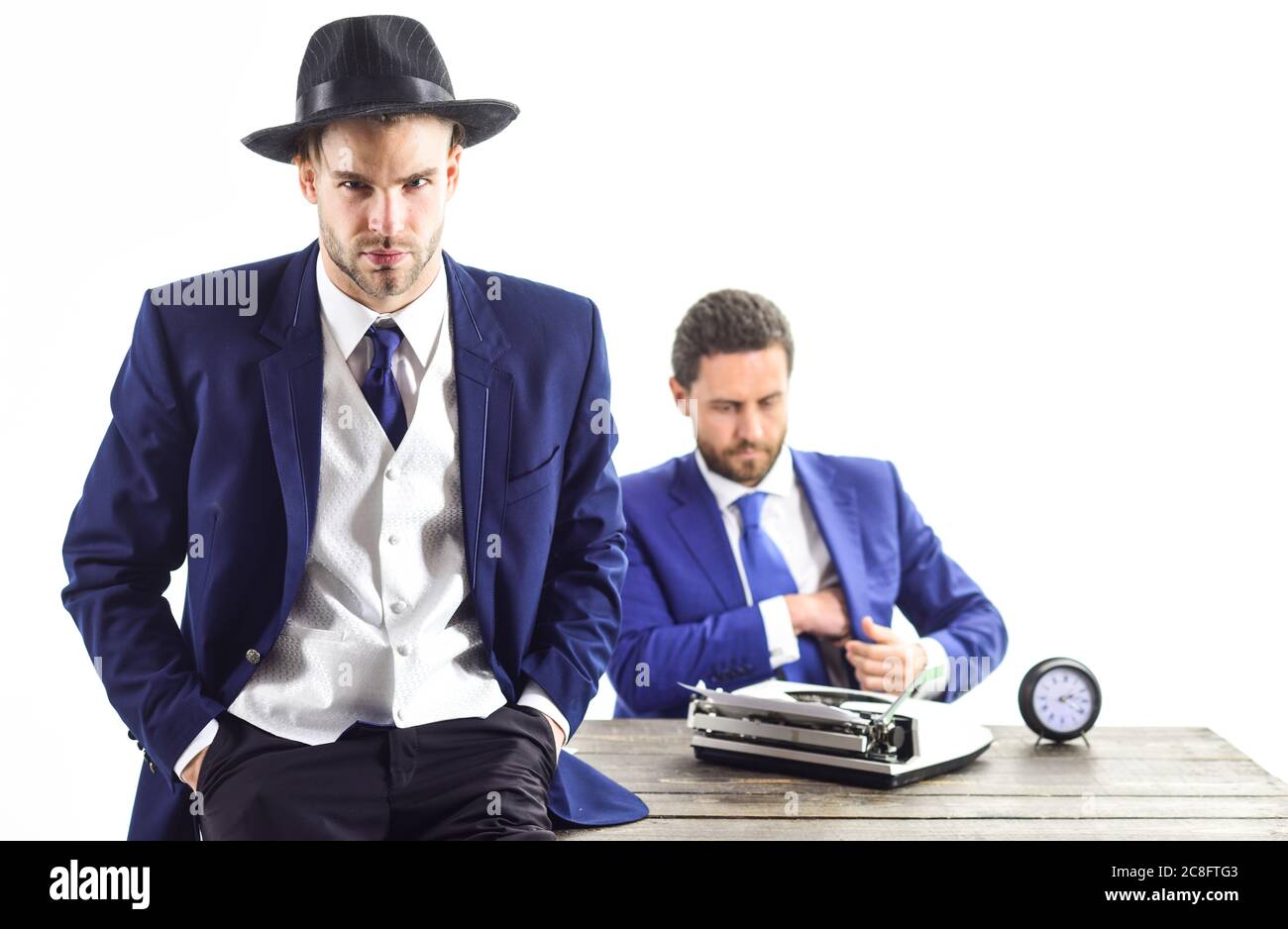 Men in suits or businessmen with serious faces in office with ...