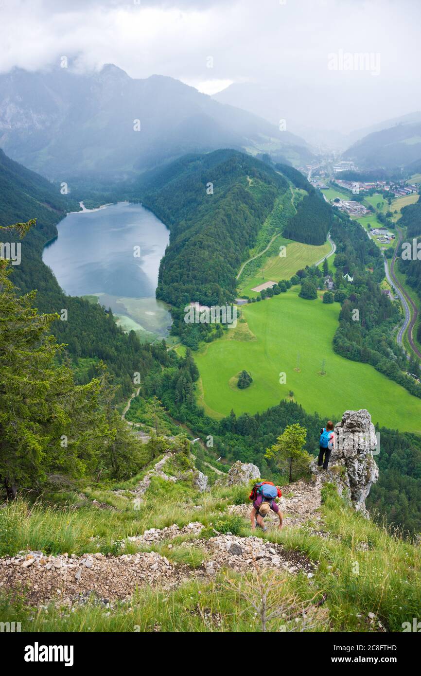 Hikers enjoying fantastic panoramic view over the alpine landscape with ...