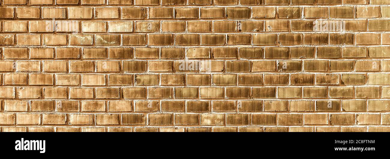 Golden Brick wall texture close up. Top view. Modern brick wall ...