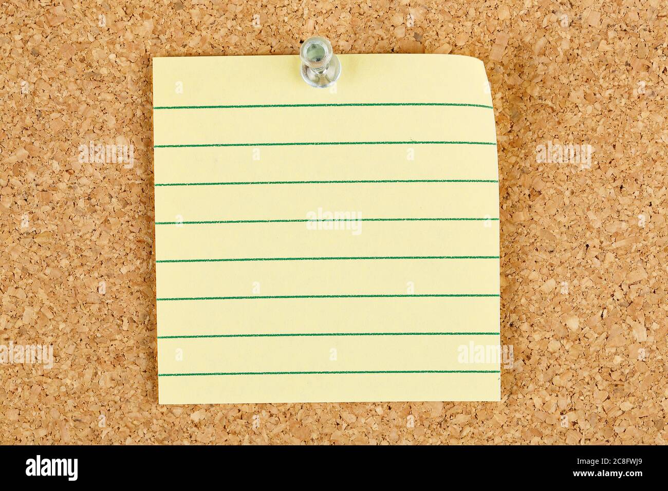 yellow blank note with lines on cork board Stock Photo - Alamy