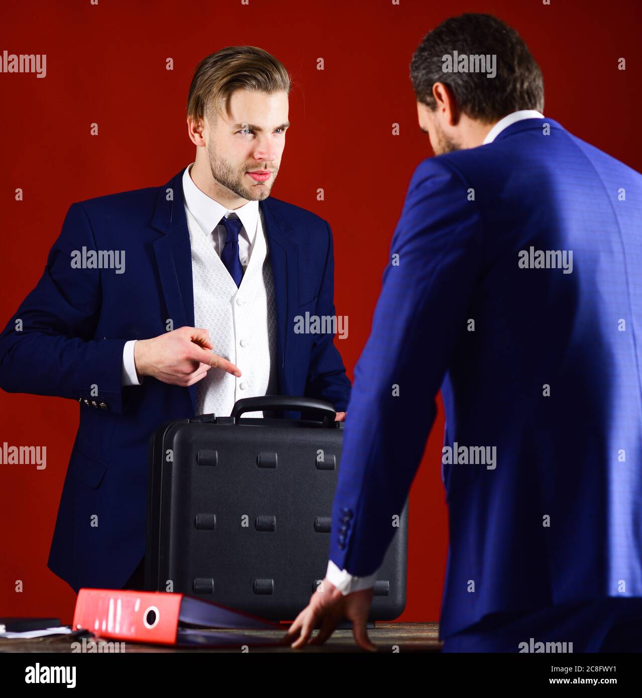 Businessman transfer deal, business black briefcase and folder with ...