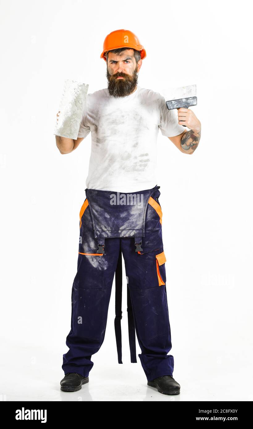 Man with beard in dirty boilersuit. Builder, plasterer, repairman ...