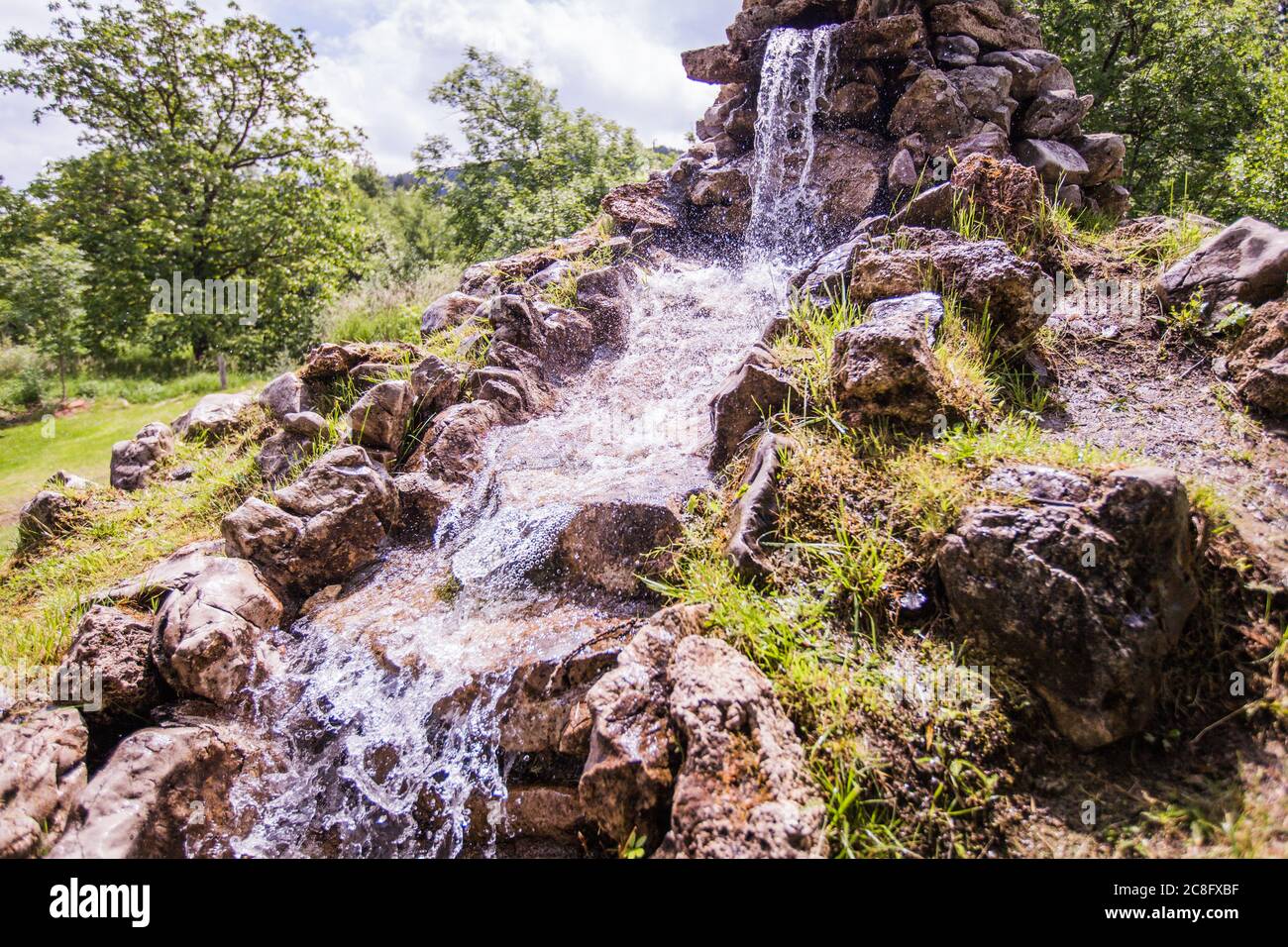 Small waterfall rocks cascade, fresh running water, summer daylight ...