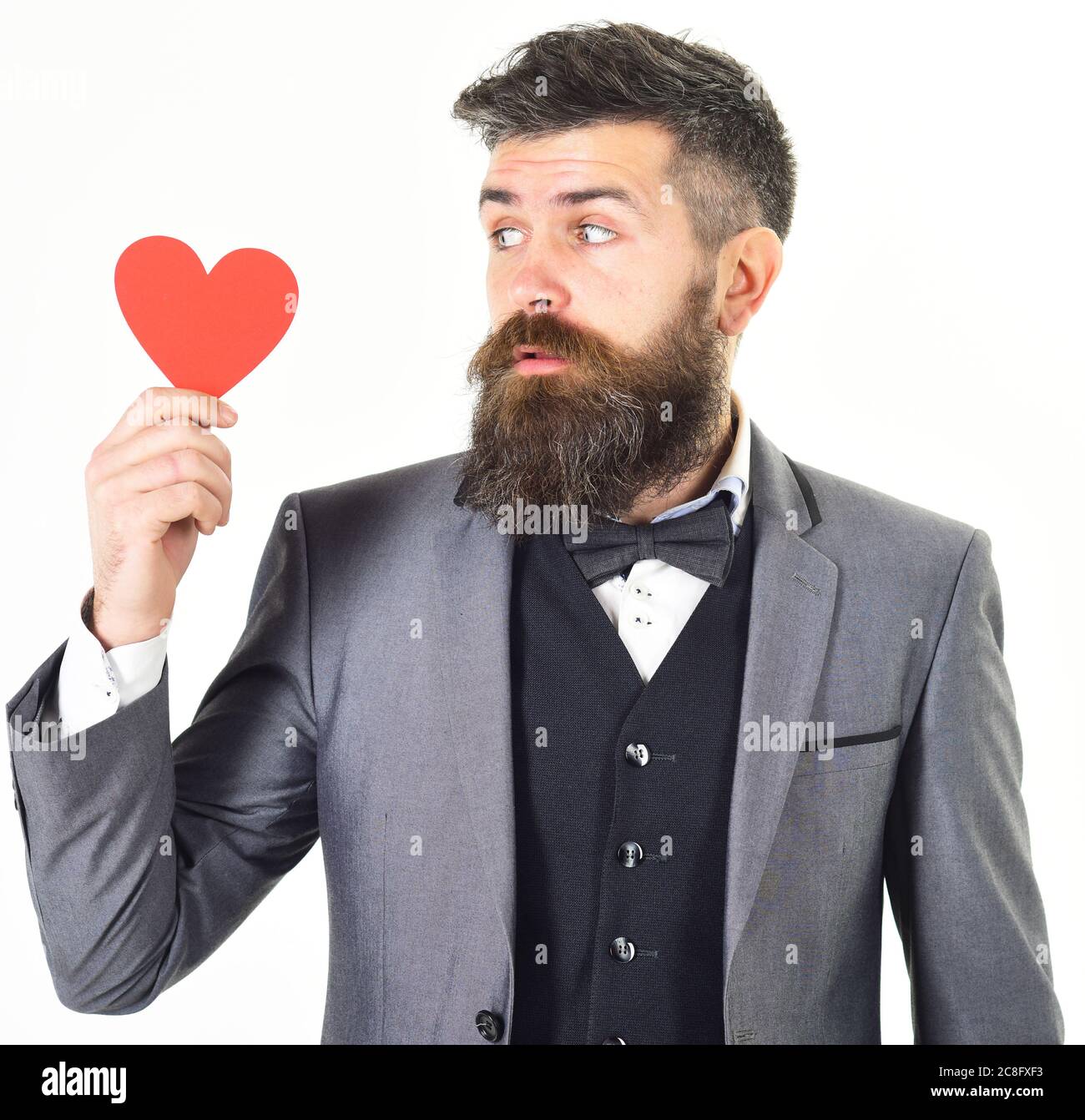bearded romantic man with long beard holding red paper heart on white ...