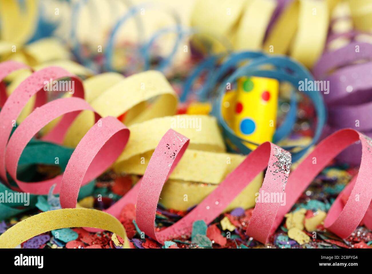 closeup of colorful party streamers on confetti Stock Photo - Alamy