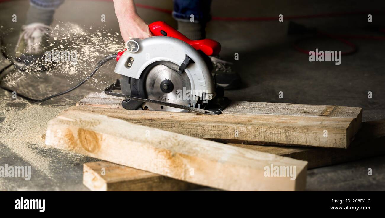 Man with saw hi-res stock photography and images - Alamy