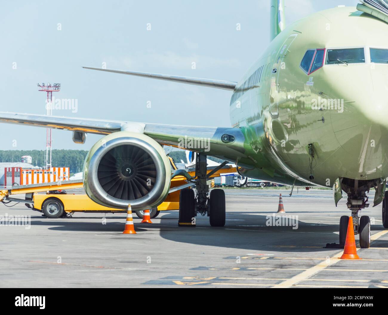 Airplane parked at the airport before departure, loading baggage Stock ...