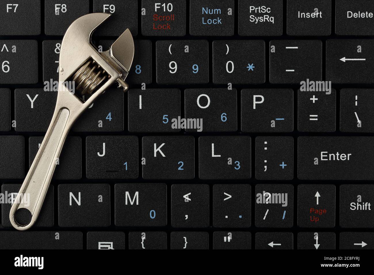 wrench on computer keyboard, computer repair or maintenance concept ...