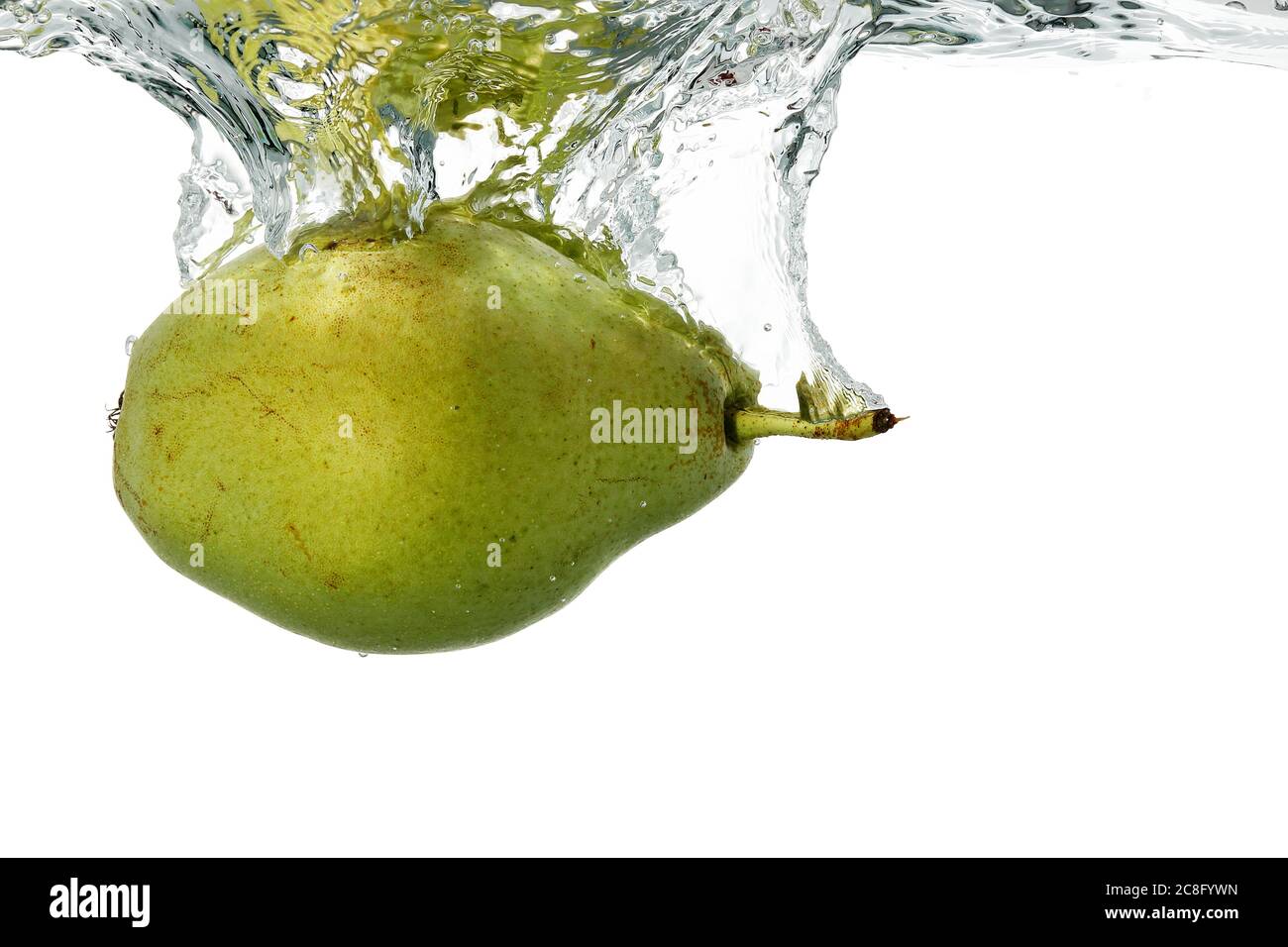 pear sinking into water on white Stock Photo - Alamy