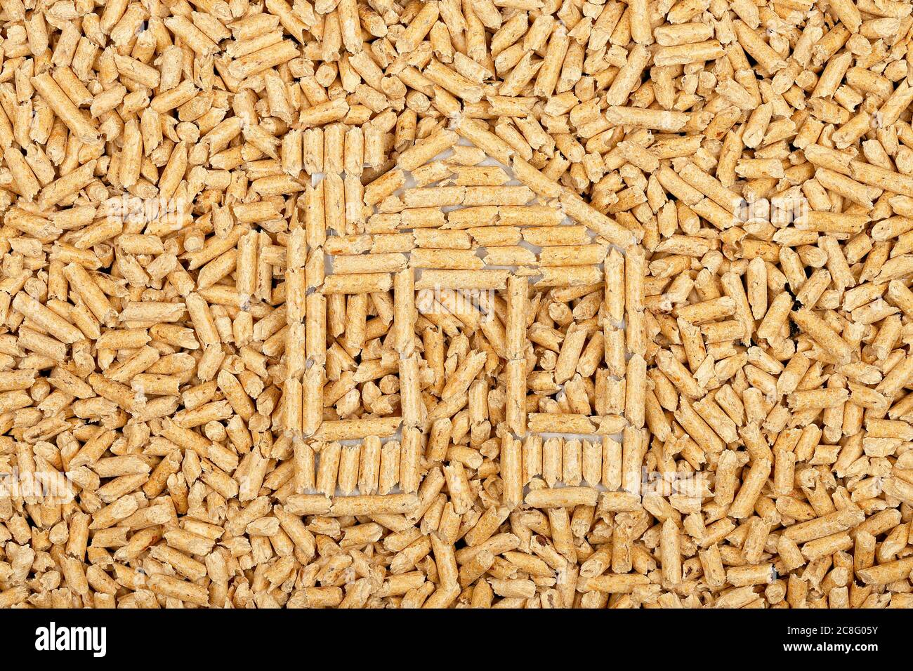 wood pellets in the shape of a house on wood pellets surface Stock ...