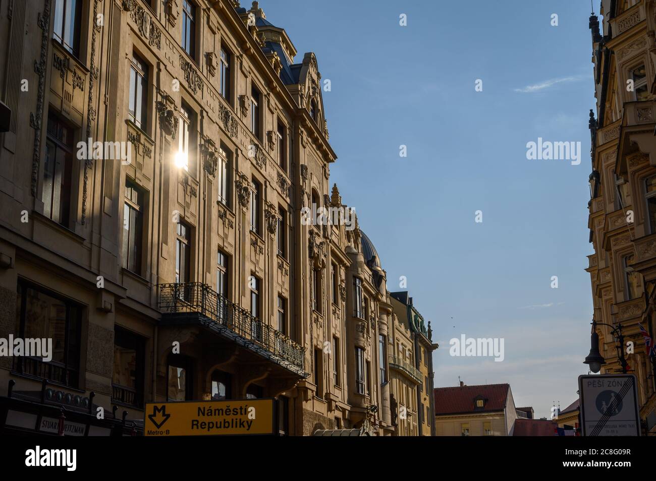 Early evening sunlight reflecting in the windows of old buildings in ...